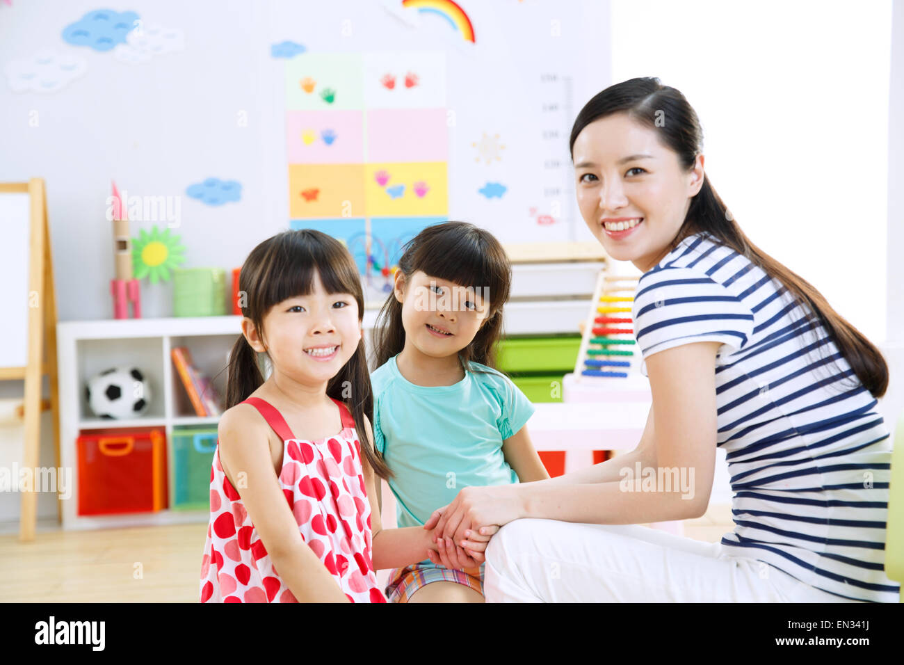 The kindergarten teachers and children Stock Photo - Alamy