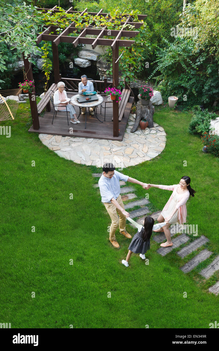 Happy family to play in the courtyard Stock Photo - Alamy