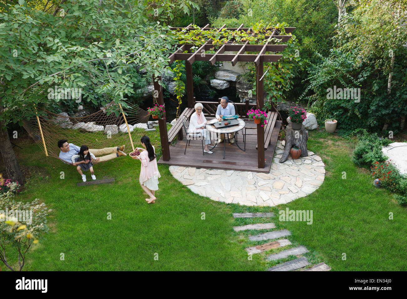 Happy family in the courtyard Stock Photo - Alamy