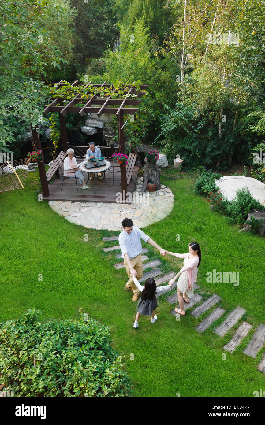 Happy family to play in the courtyard Stock Photo - Alamy