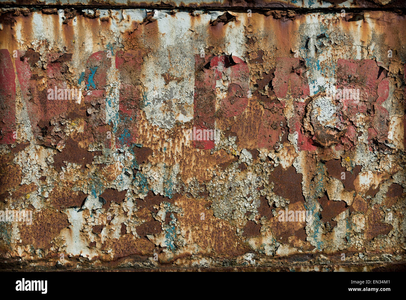 Peeling paint on an old rusty metal sign Stock Photo - Alamy