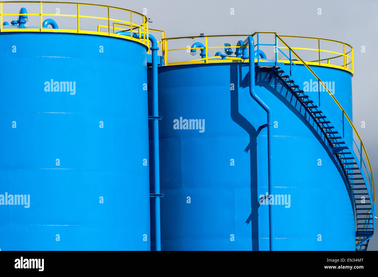 Blue industrial chemical tanks Stock Photo - Alamy