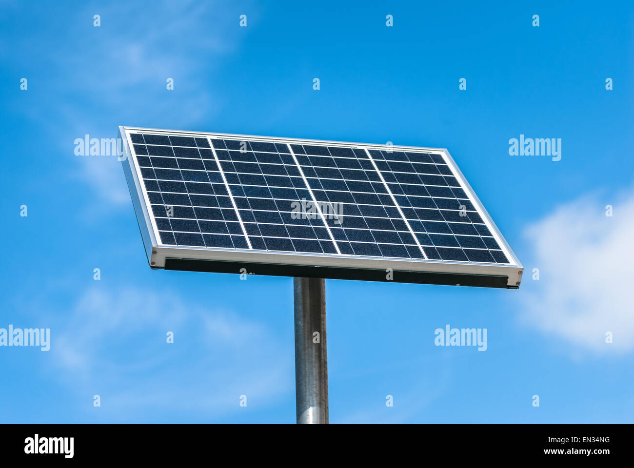 A single, freestanding solar panel isolated against a blue sky Stock ...