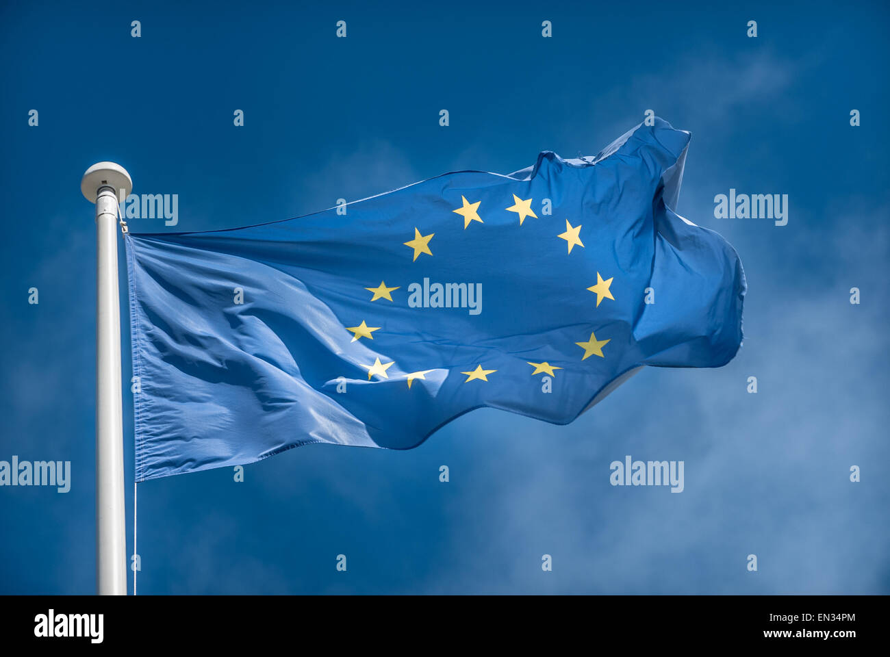 European Union flag blowing in the wind on blue sky background Stock ...