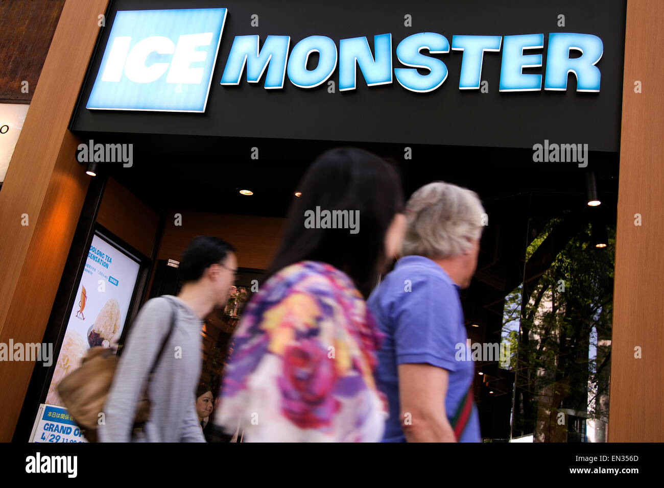 Pedestrians pass next to the new shaved ice restaurant “Ice Monster” in ...