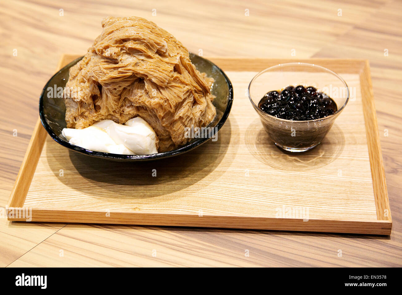 A Tapioca Milk Tea shaved ice which cost is 8, 50 USD on display during ...