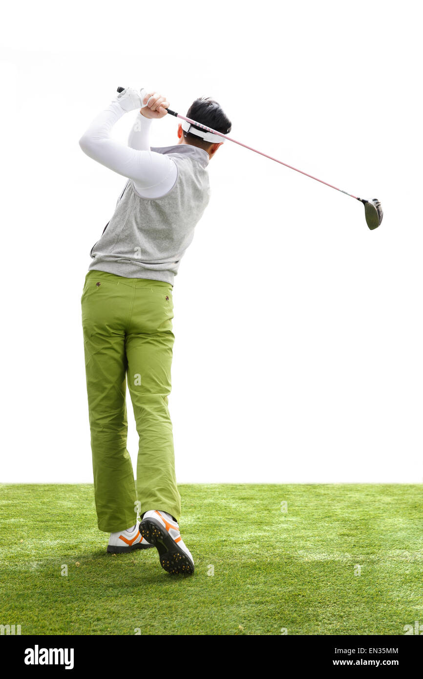 A young man is playing golf Stock Photo - Alamy