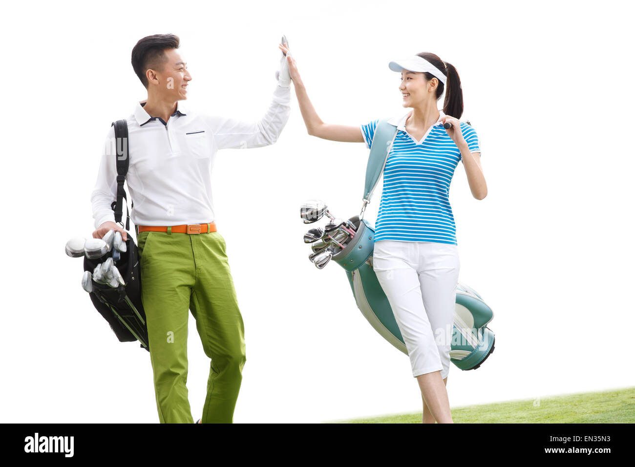 Young lovers playing golf Stock Photo - Alamy