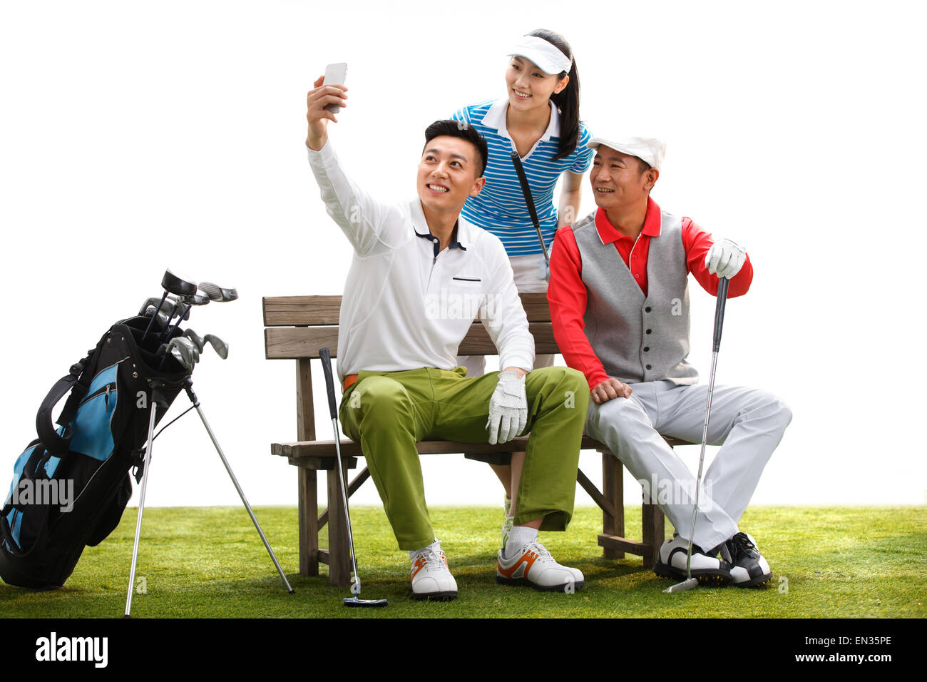 The golfer to take pictures in the grass Stock Photo - Alamy