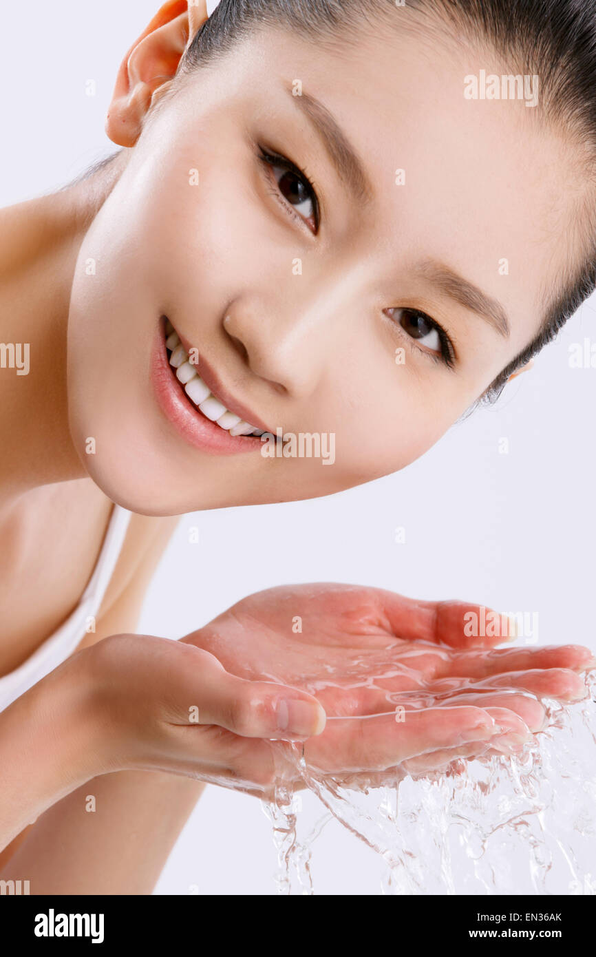 Young women are using water cleansing Stock Photo - Alamy