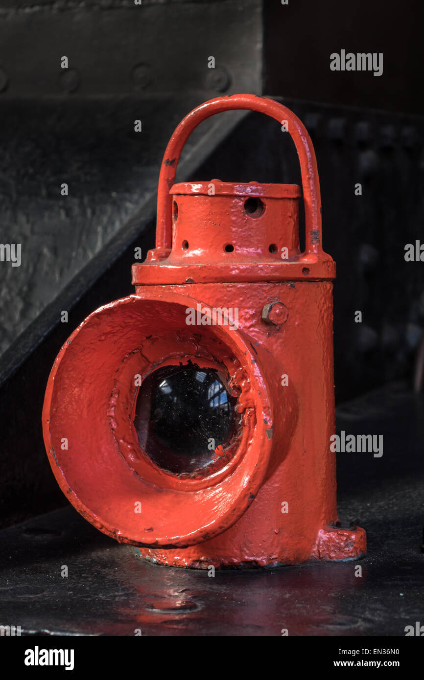 An old red railway train lantern on a steam engine Stock Photo - Alamy