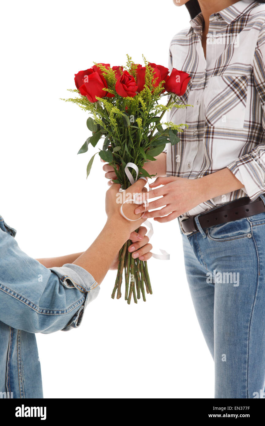 The young man gave the young woman flowers Stock Photo - Alamy