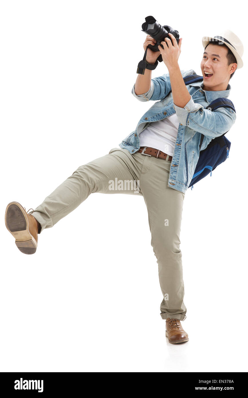 Young man camera smiling Cut Out Stock Images & Pictures - Alamy