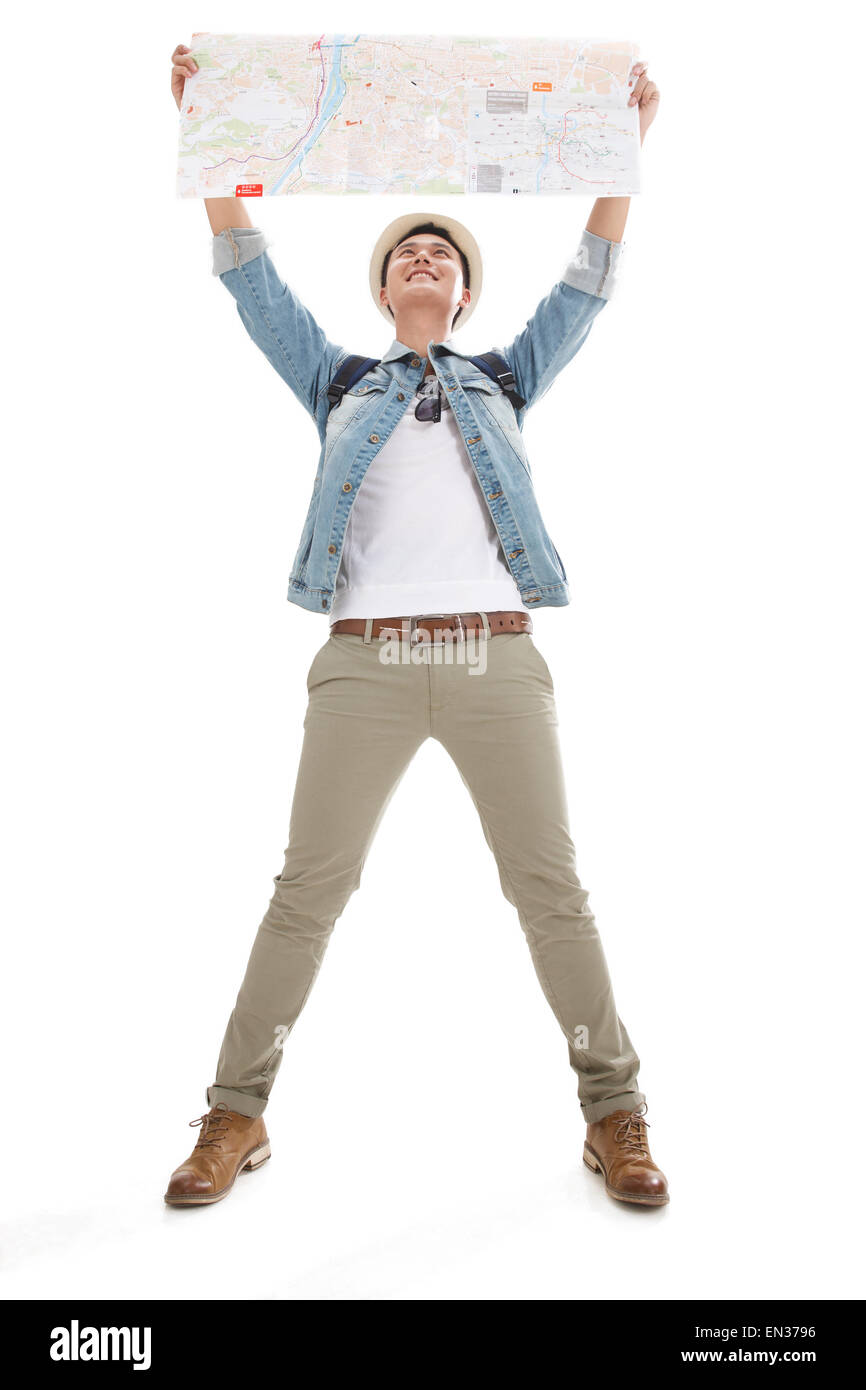 The young man took the map to travel Stock Photo - Alamy