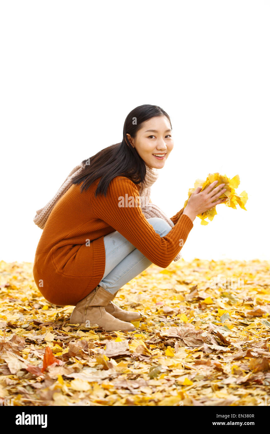 Happy young woman with leaves Stock Photo - Alamy