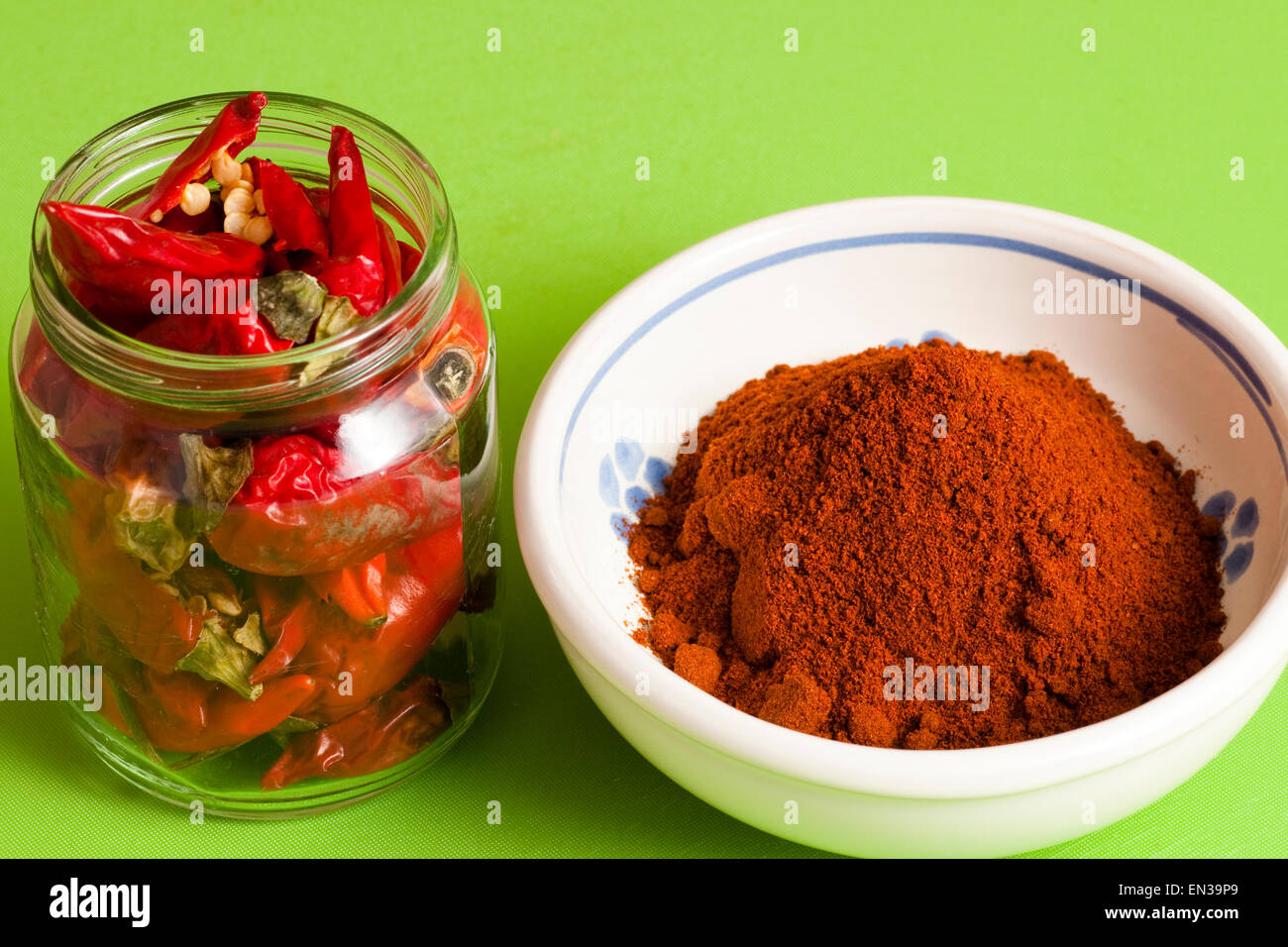 red hot chili peppers whole and ground Stock Photo - Alamy