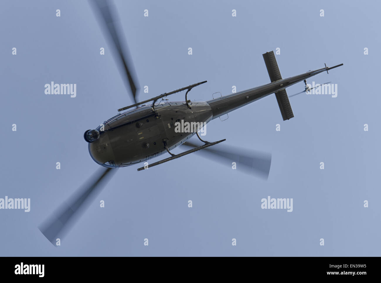 view from beneath of helicopter filming a race Stock Photo - Alamy