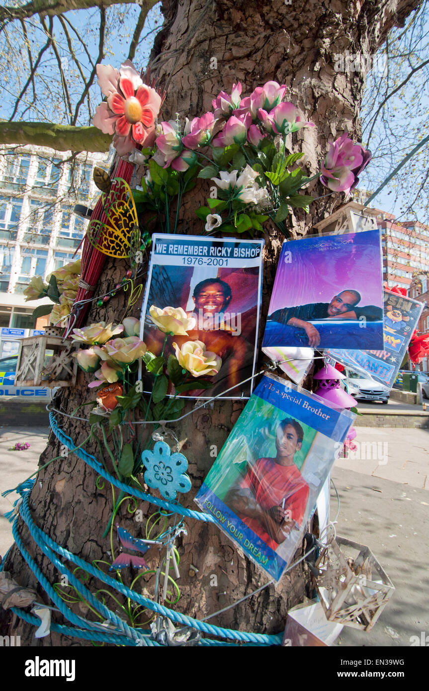 Posters pinned on tree as tribute outside Brixton Police Station ...