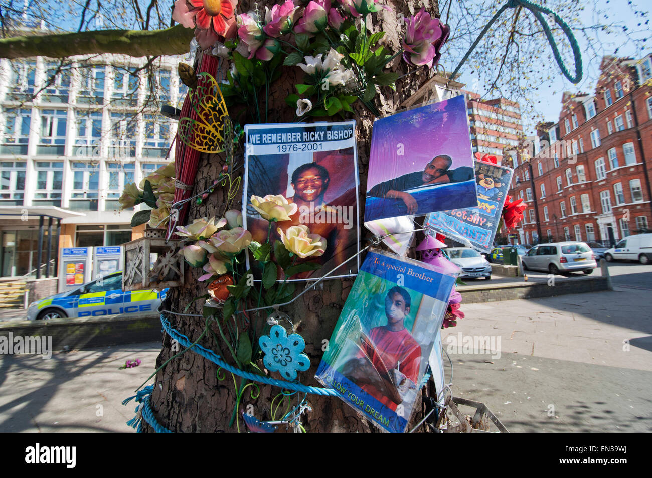 Posters pinned on tree as tribute outside Brixton Police Station ...