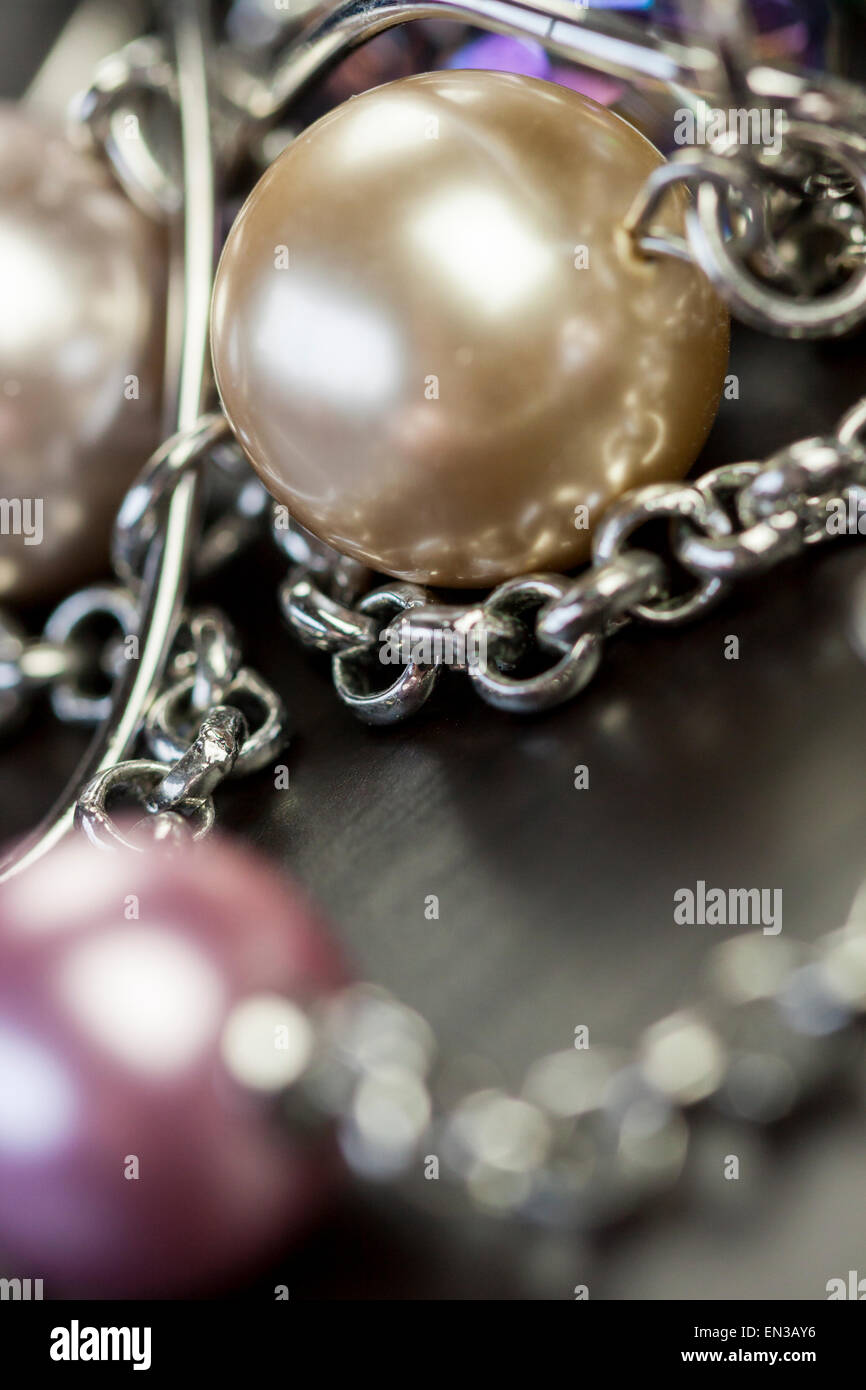 Gold beads attached hi-res stock photography and images - Alamy