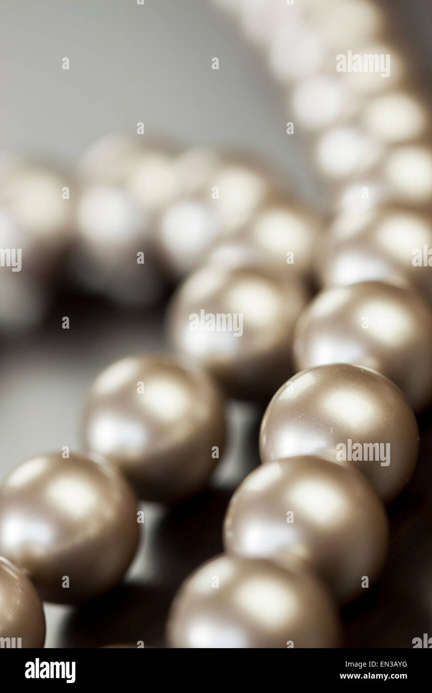 Gold string beads hi-res stock photography and images - Alamy