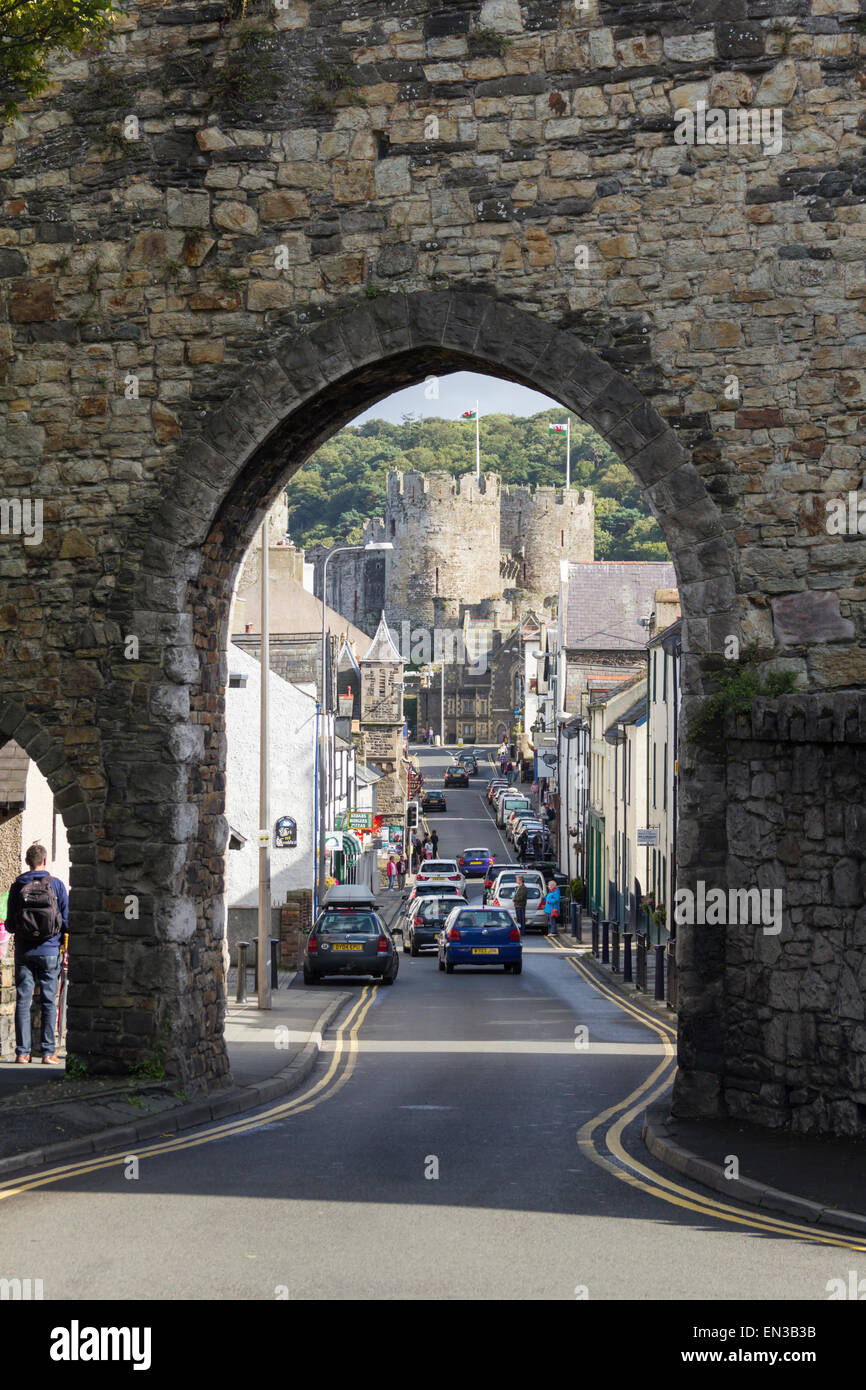 Narrow gateway in Conwy town walls leading to Berry Street with Castle ...