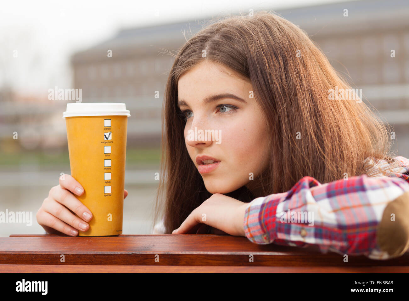 Young woman drinking coffee Stock Photo - Alamy