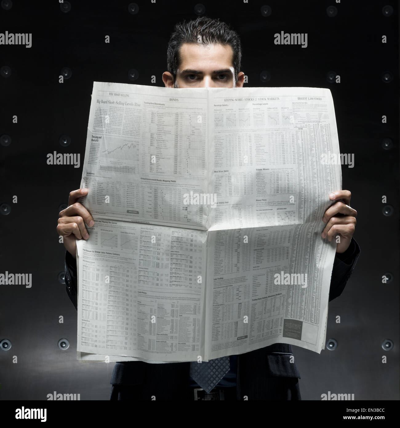 businessman holding a newspaper Stock Photo - Alamy