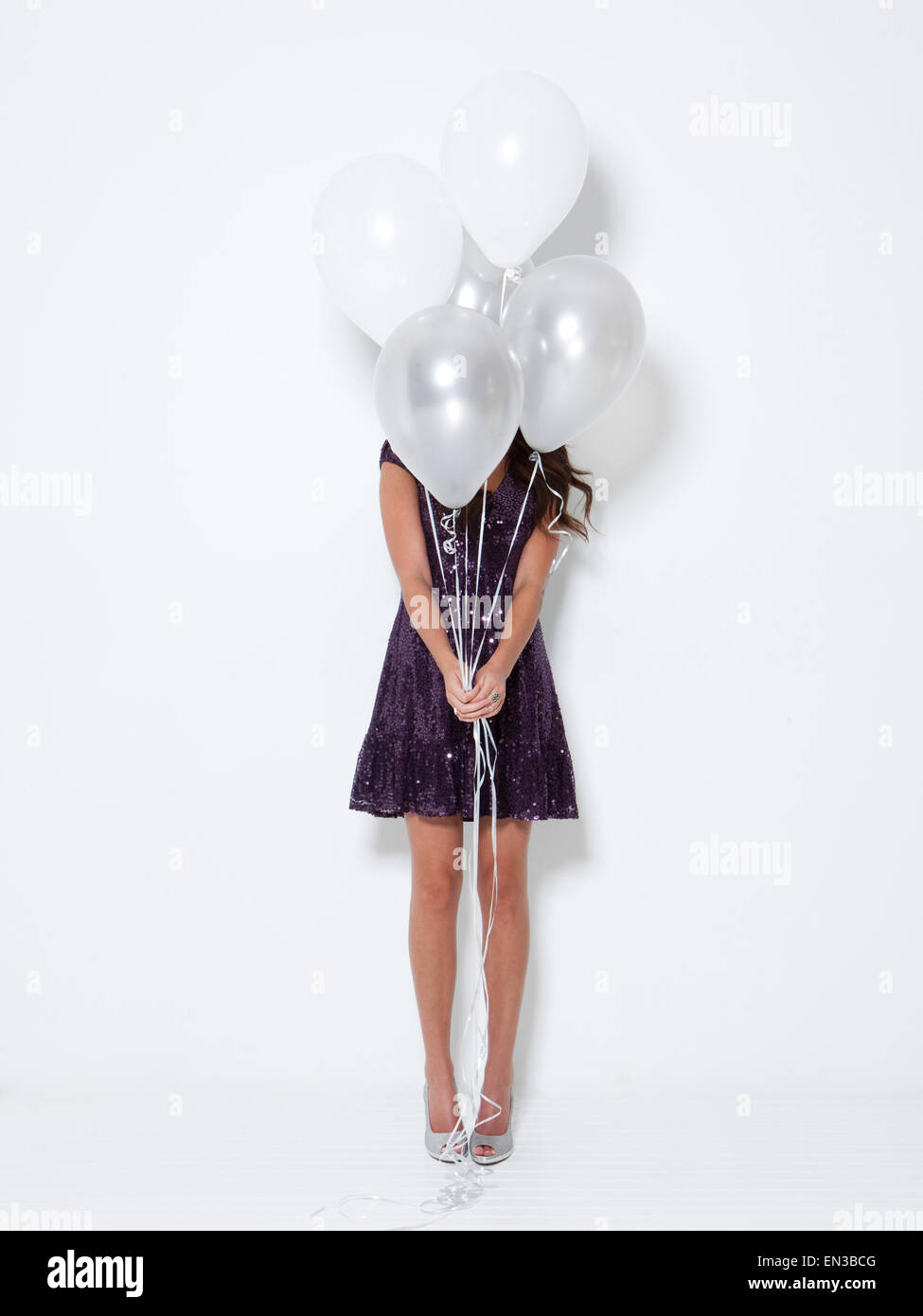 Face behind balloons hi-res stock photography and images - Alamy