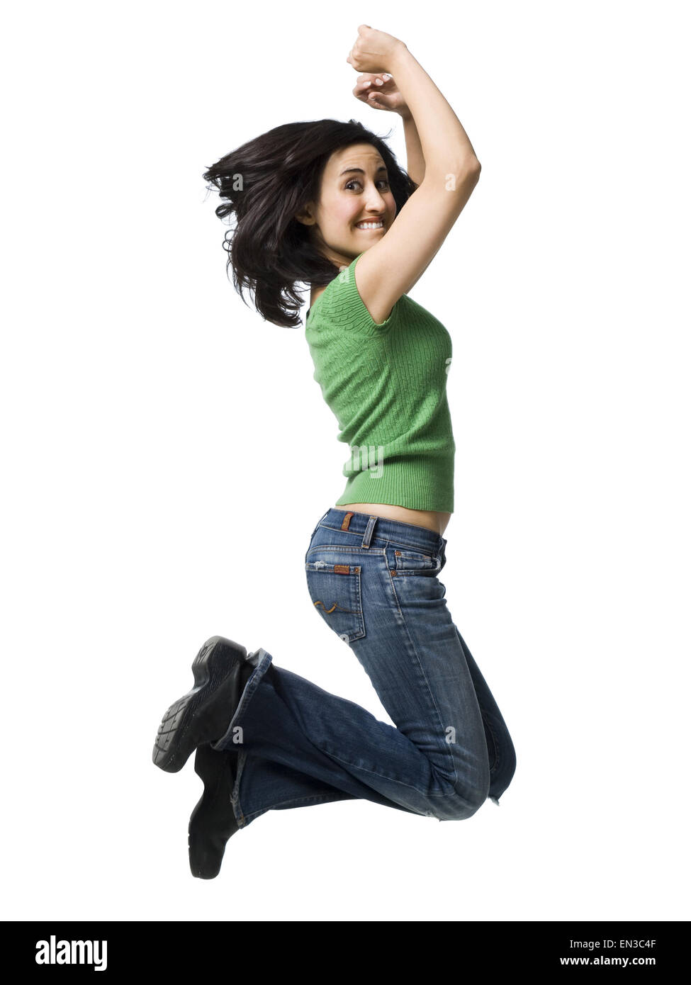 Woman leaping and smiling Stock Photo - Alamy