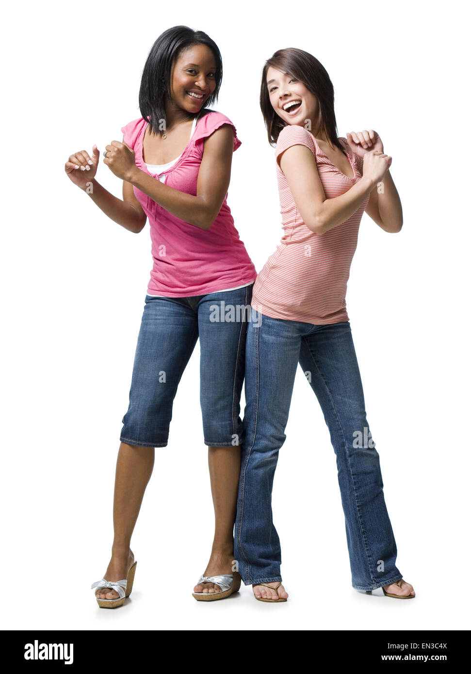 Two women smiling and dancing Stock Photo - Alamy