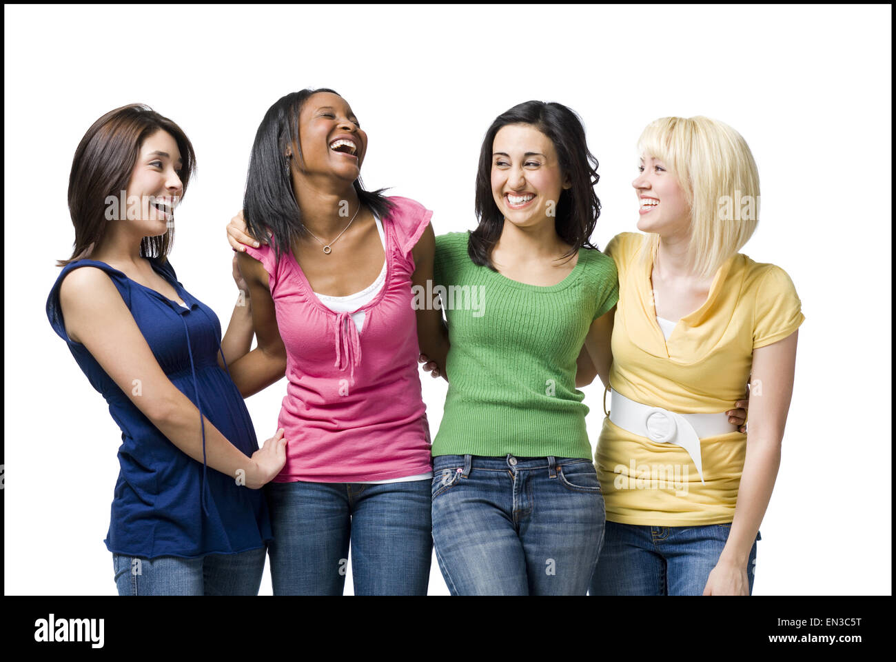 Four women hugging and smiling Stock Photo - Alamy