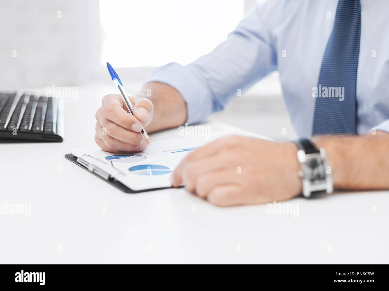 businessman working and signing papers Stock Photo - Alamy
