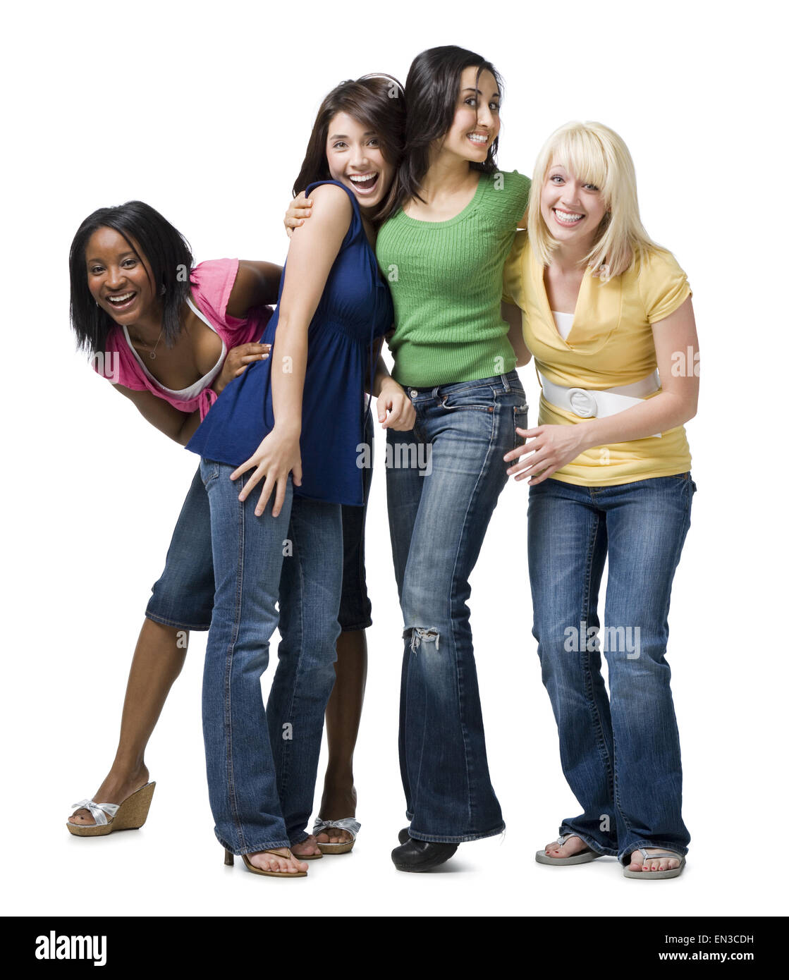 Four women hugging and smiling Stock Photo - Alamy