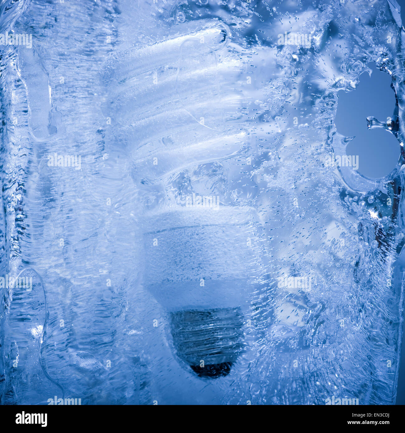 light bulb frozen in a block of ice Stock Photo - Alamy