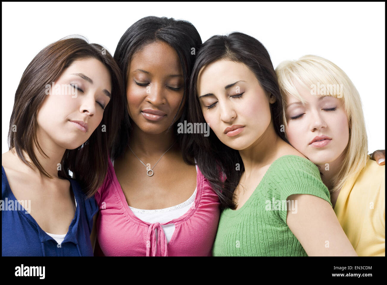 Four women hugging with eyes closed Stock Photo - Alamy