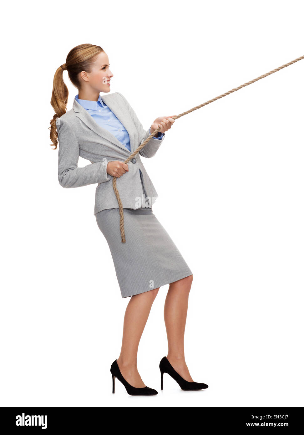 smiling businesswoman pulling rope Stock Photo - Alamy