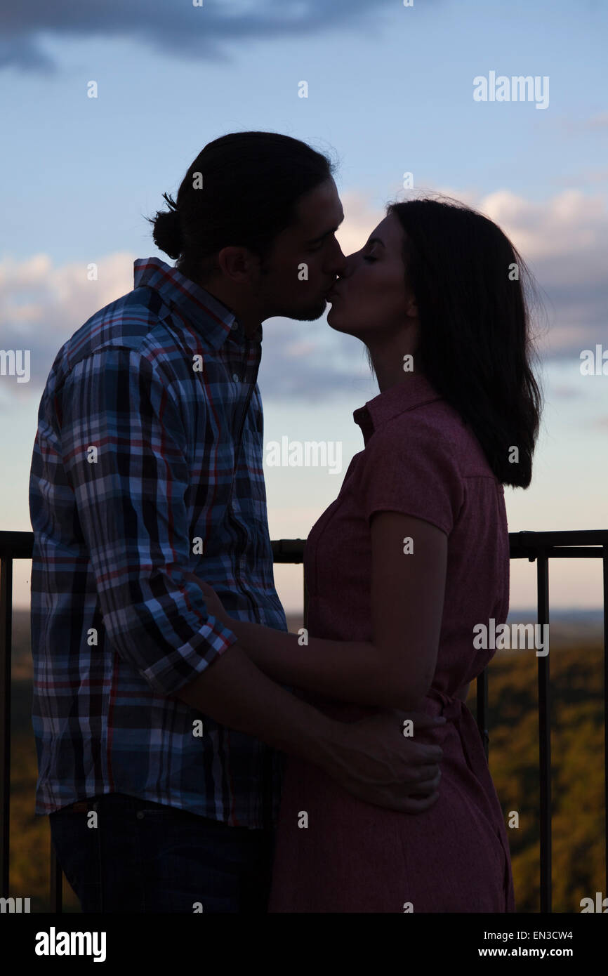 Italy, Tuscany, Couple kissing on terrace at dusk Stock Photo - Alamy
