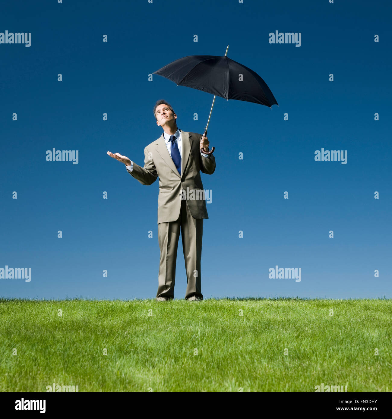 man holding an umbrella checking for rain Stock Photo - Alamy