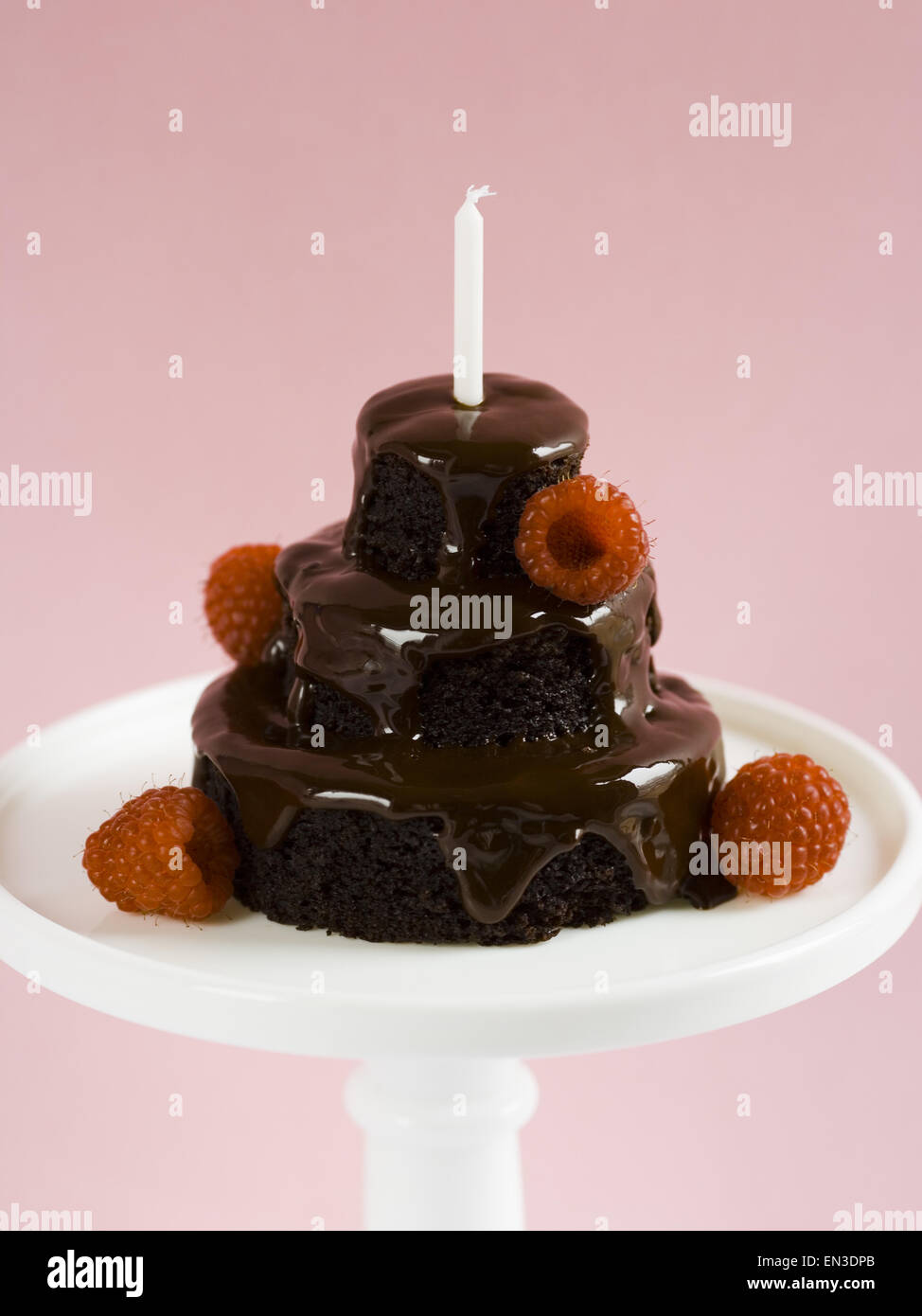 Chocolate birthday cake with raspberries and candle Stock Photo - Alamy