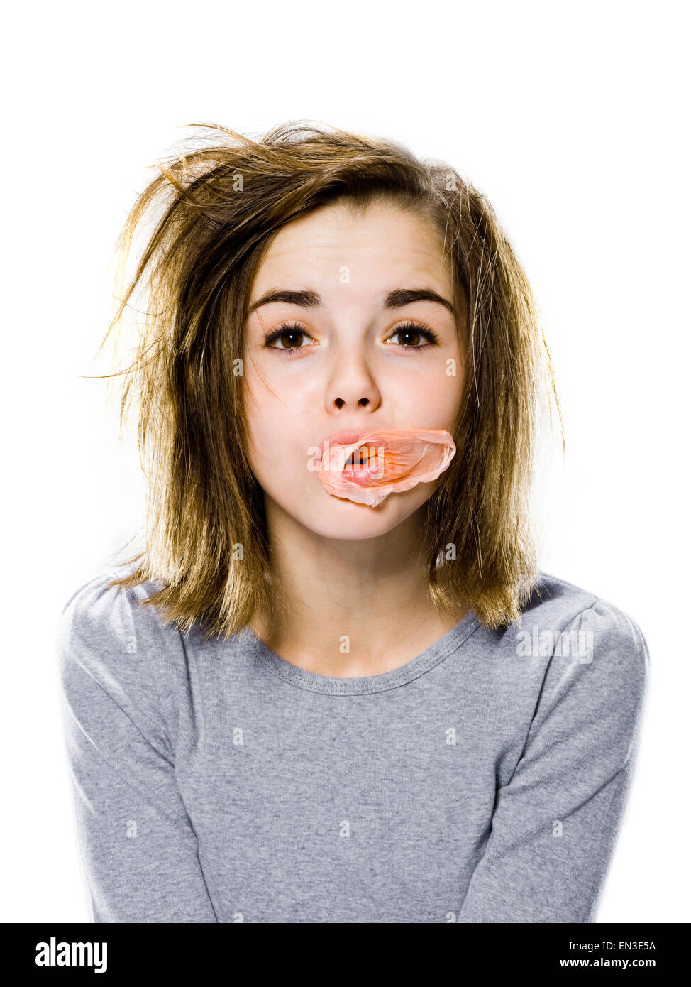 girl with a messy appearance popping a bubble gum bubble Stock Photo ...