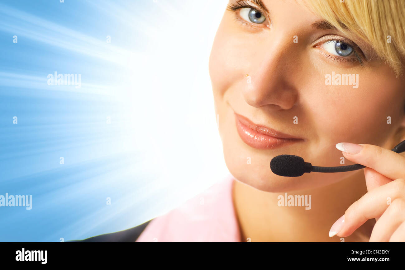 Friendly phone operator on blue abstract background Stock Photo - Alamy