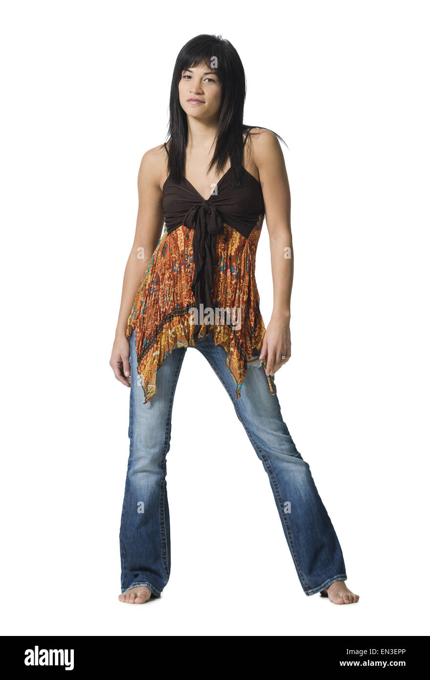 Woman standing and smiling Stock Photo - Alamy