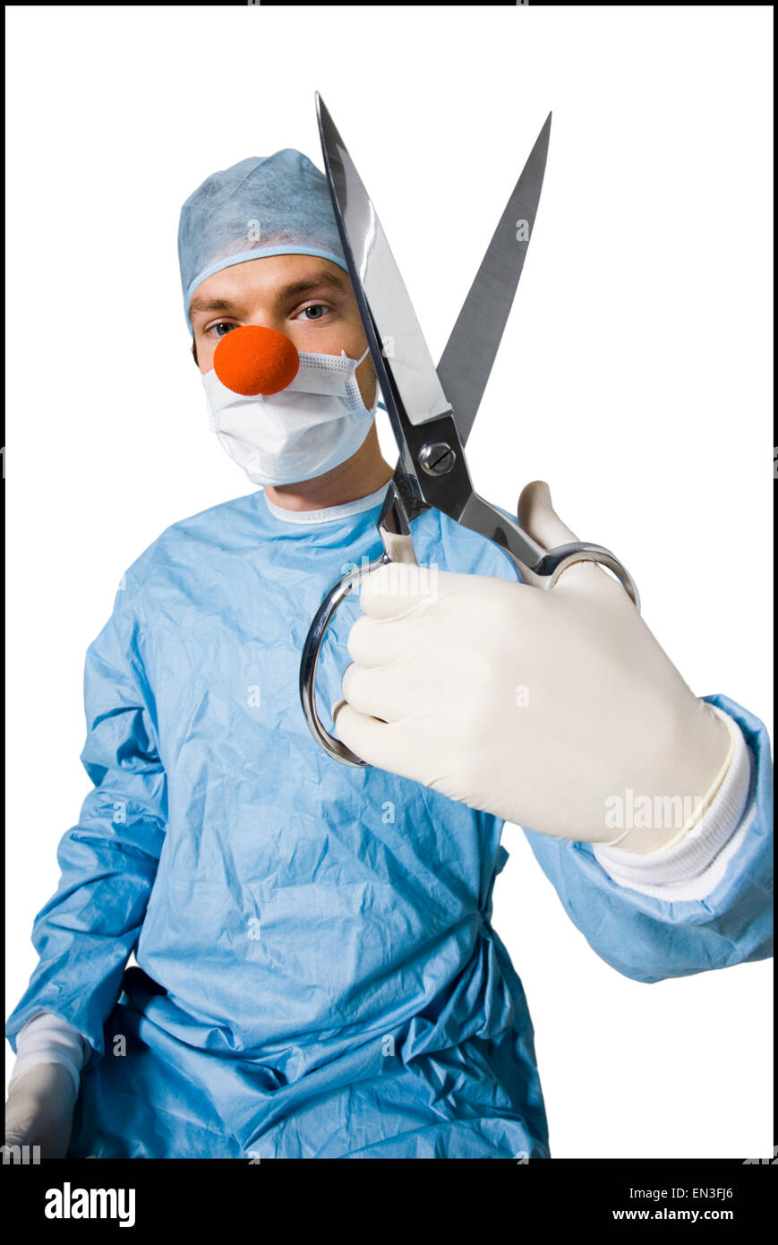 surgeon wearing a creepy clown nose and holding scissors Stock Photo ...