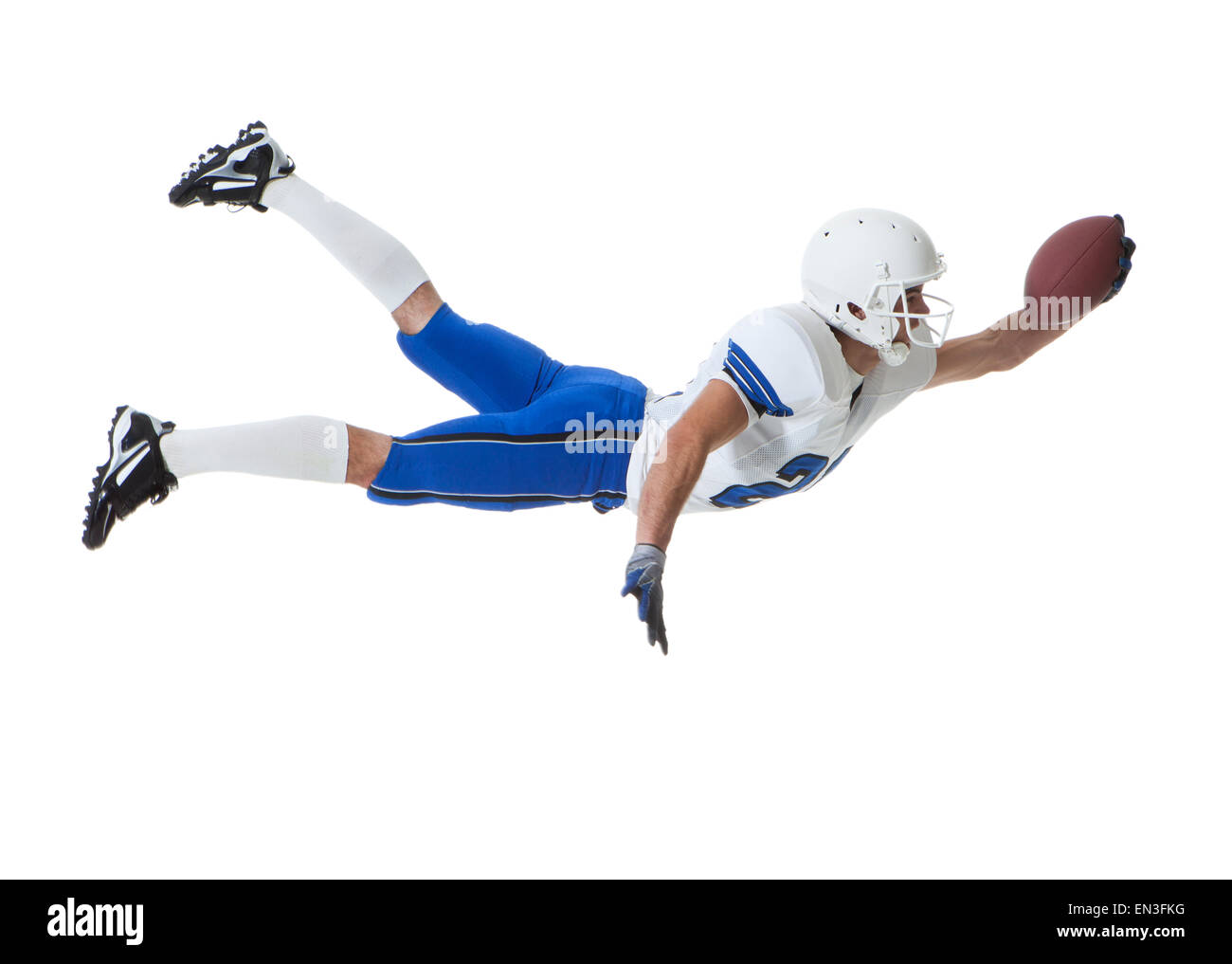 Male player of American football catching ball, studio shot Stock Photo ...
