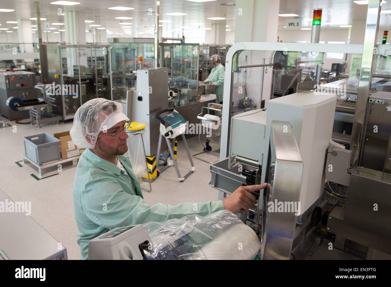 Jena, Germany. 27th Apr, 2015. Machine operator Oliver Schuchardt works ...