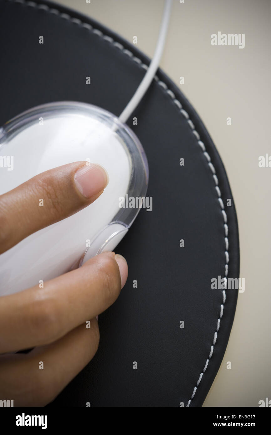 Female hand on mouse Stock Photo - Alamy