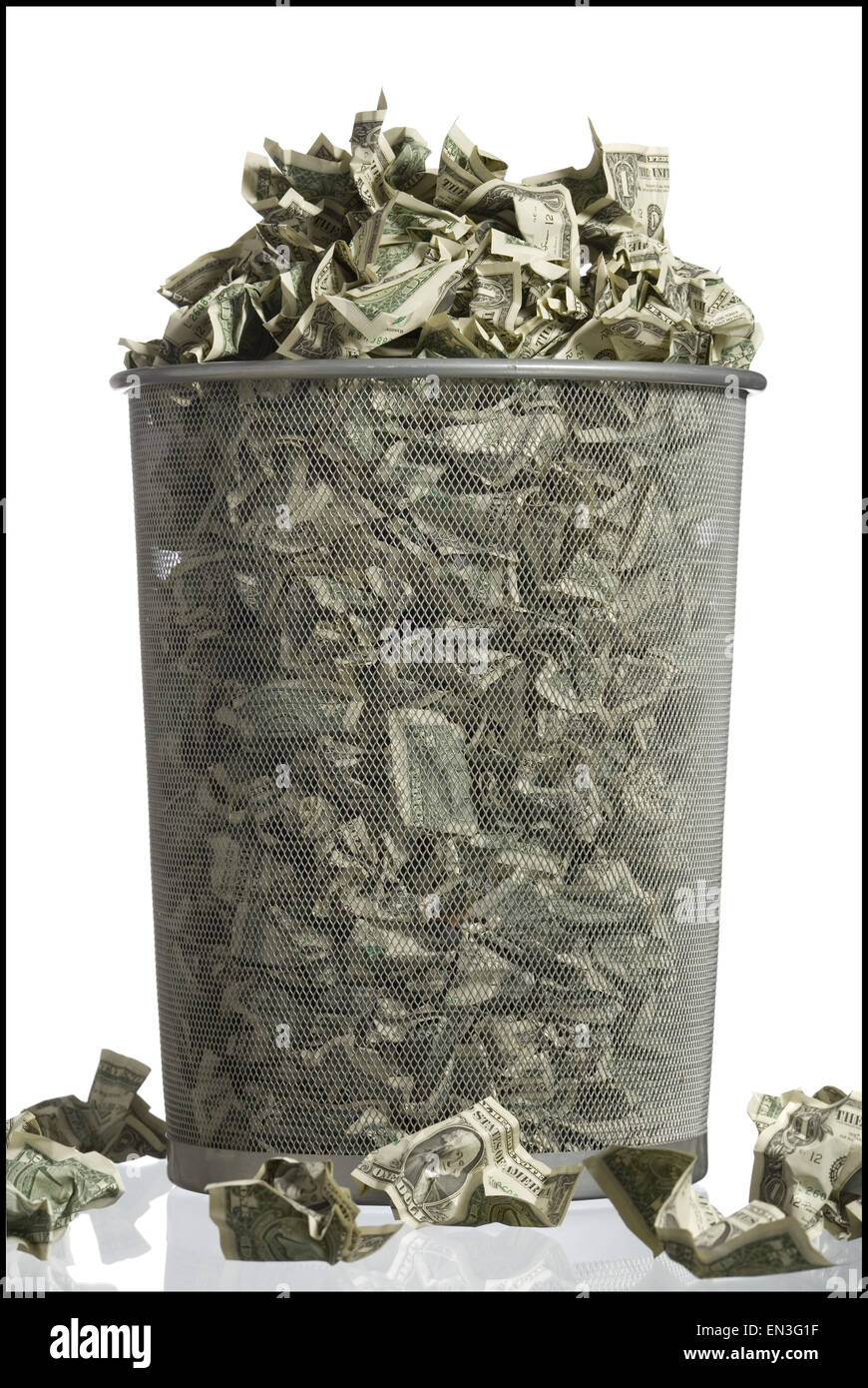 Waste paper basket with crumpled money Stock Photo - Alamy