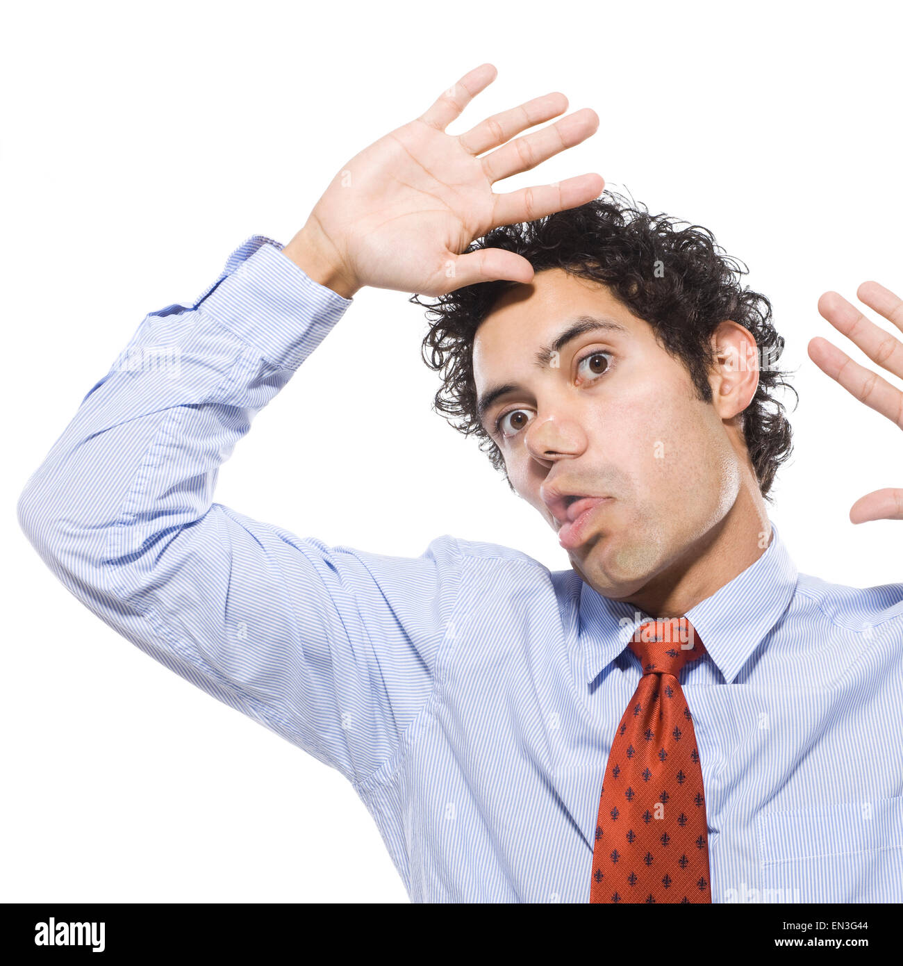 Young man trapped against glass Stock Photo - Alamy