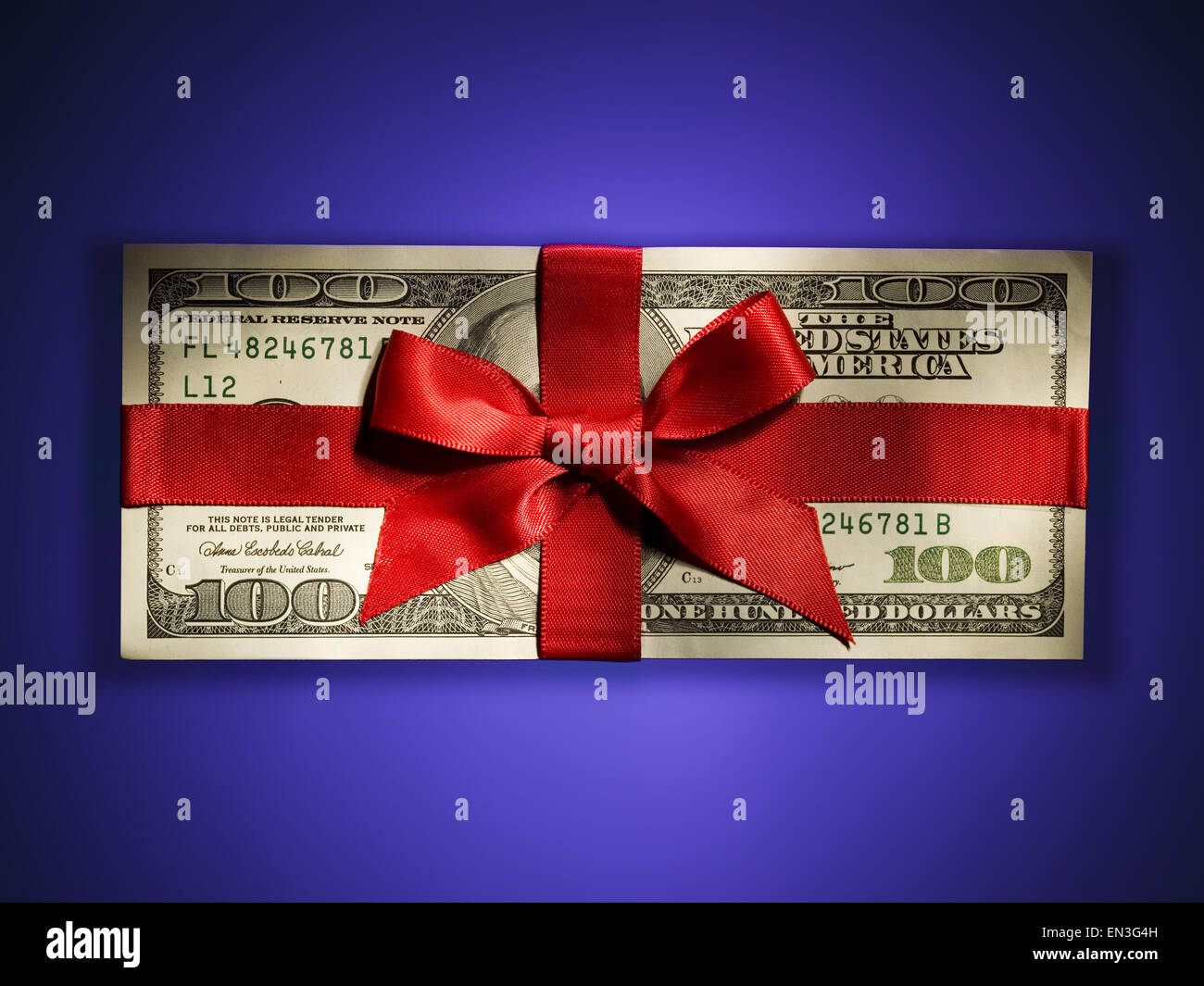 One hundred US dollar banknote with red ribbon Stock Photo - Alamy